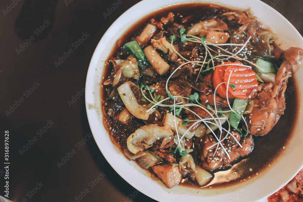 Braised chicken (Jim dak or Jjim Dak) made with cutted chicken, onion ...