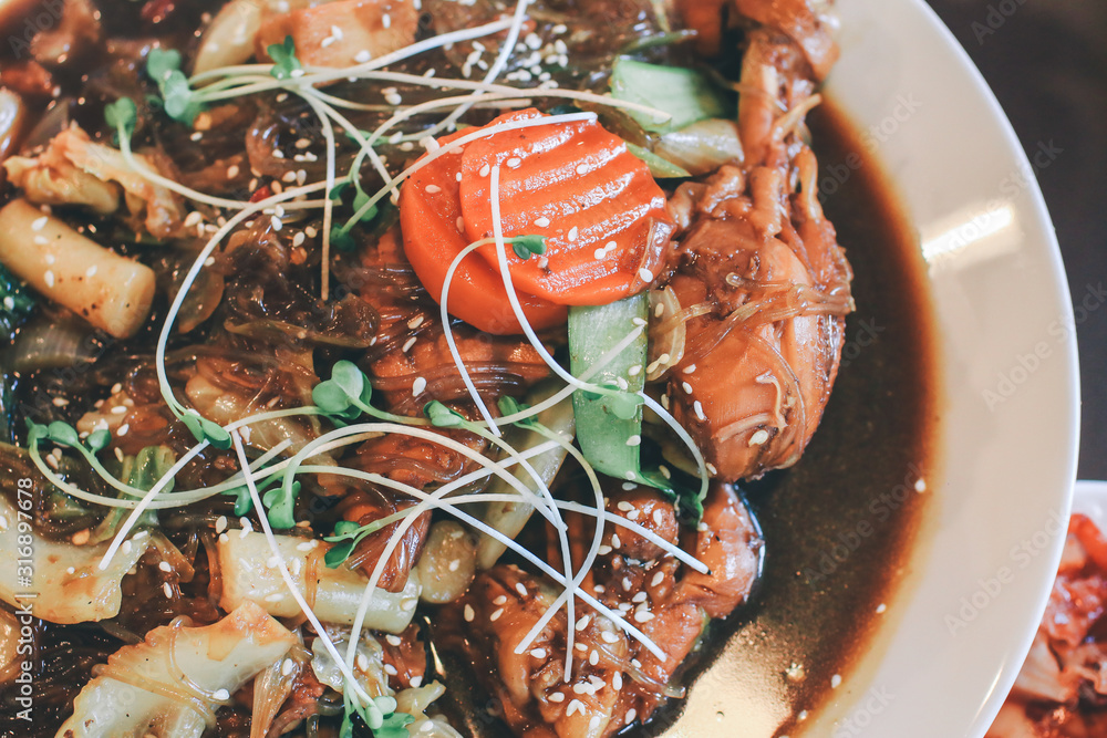 Braised chicken (Jim dak or Jjim Dak) made with cutted chicken, onion ...