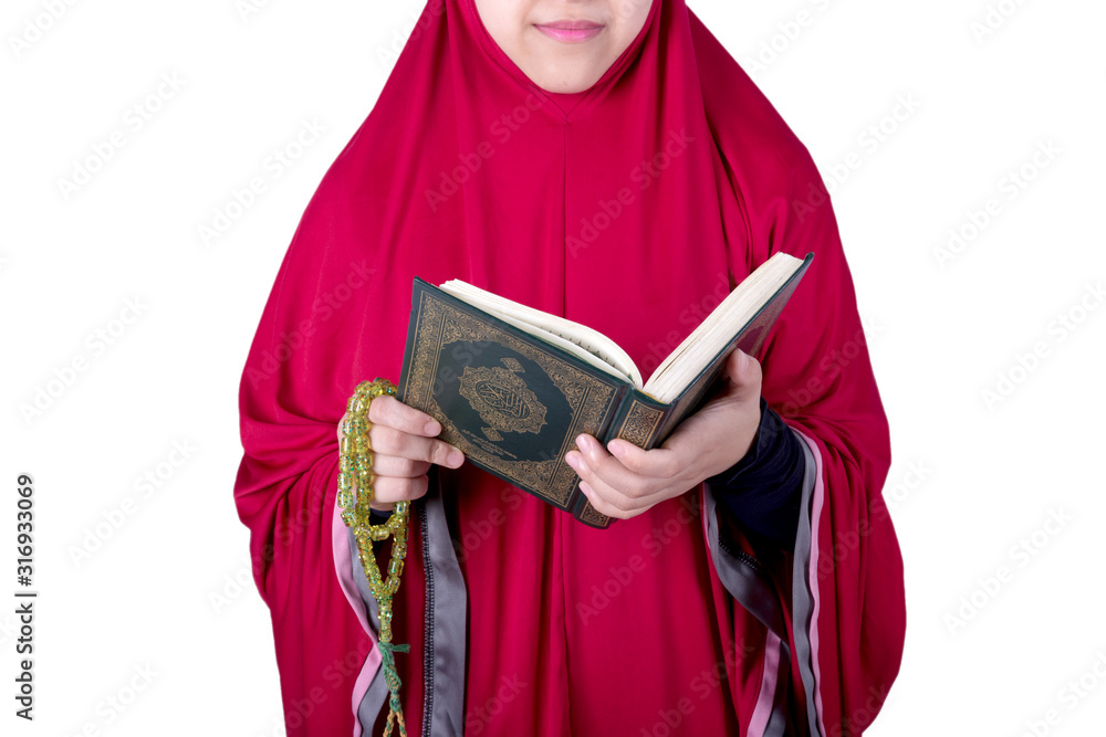 Beautiful young muslim woman read Quran with tasbih in the Ramadan time ...
