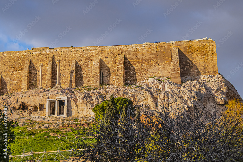 Picturesque view of Greek ruins at the Acropolis hill on sunset. The ...