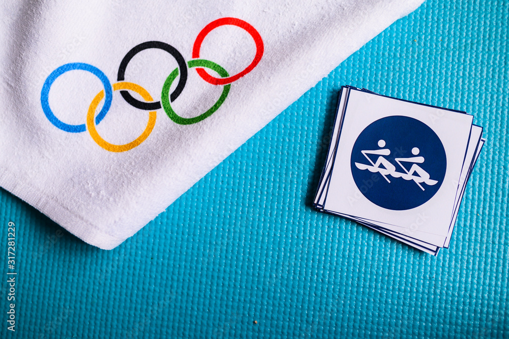 TOKYO, JAPAN, JANUARY. 20. 2020: Rowing pictogram and olympic rings ...