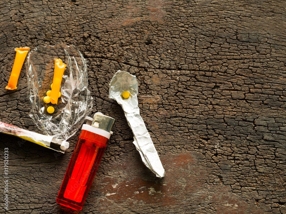 Narcotic Recreational drugs concept. amphetamine,orange straw,cigarette ...