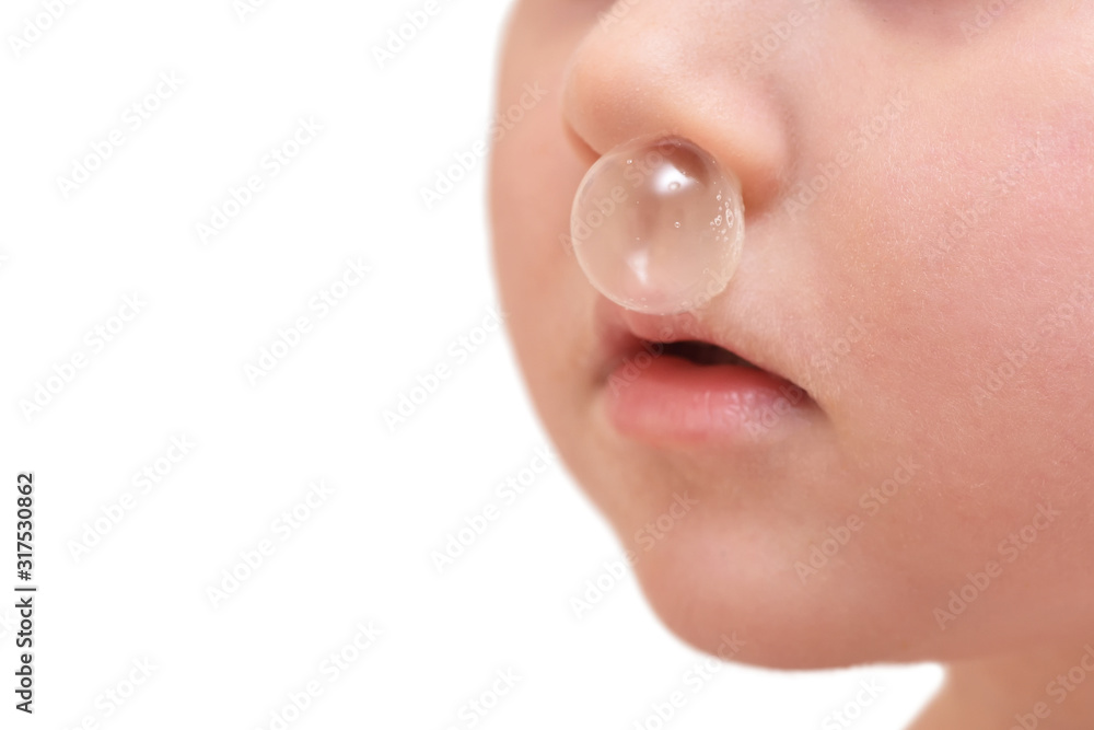 Baby girl and big bubble of snot from nose close up. Stock Photo ...