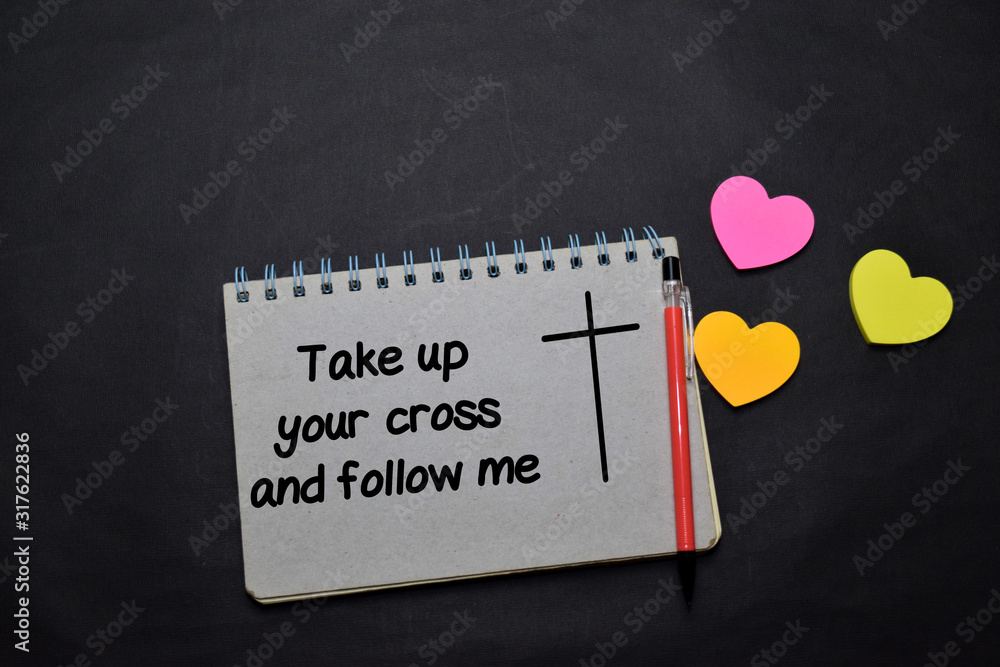 Take up Your Cross and Follow Me write on a book isolated on office ...