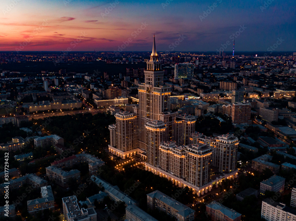 Night Moscow, high-rise building on a sunset background. Night view of ...