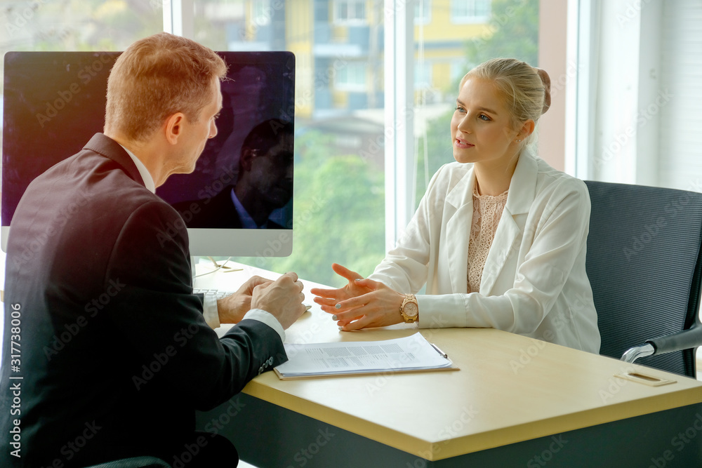 Beautiful blond hair girl talk with the business man for job interview ...