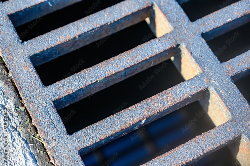 Foto de Stock Storm water cast iron grate over collection piping ...