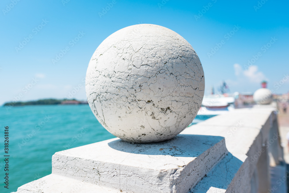 Stone Bridge Balls. Stone balls on bridge parapet on blue Lagoon in ...
