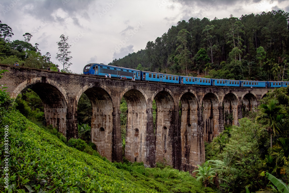 Iconic Blue Train Crossing Nine Arches Bridge in Sri Lanka Stock Photo ...