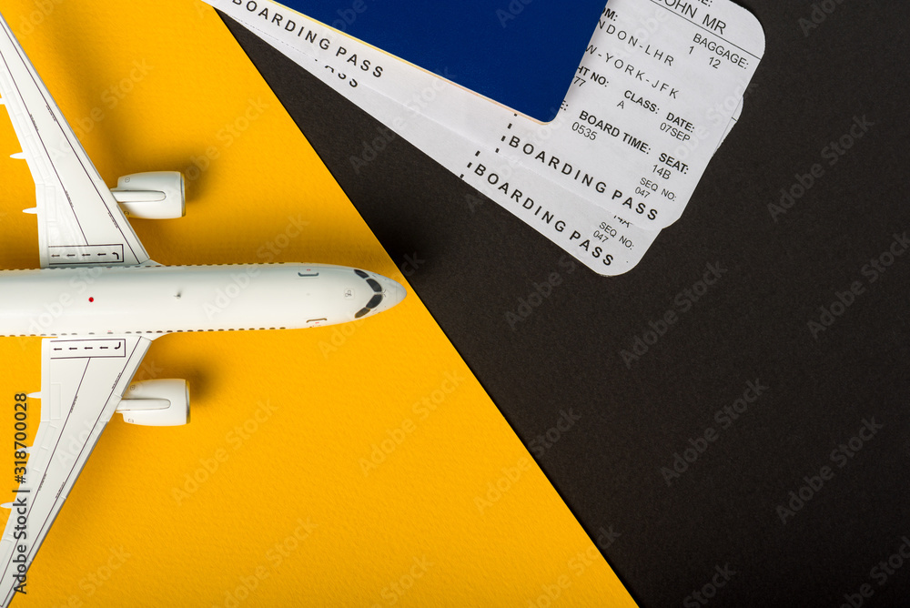Aircraft top view, Airline boarding pass tickets on the desk. The ...