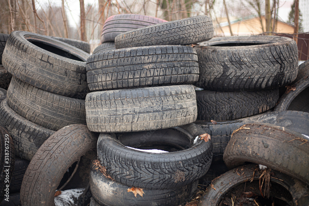 Rubber tires in a landfill. Old wheels from cars. Recycling rubber ...