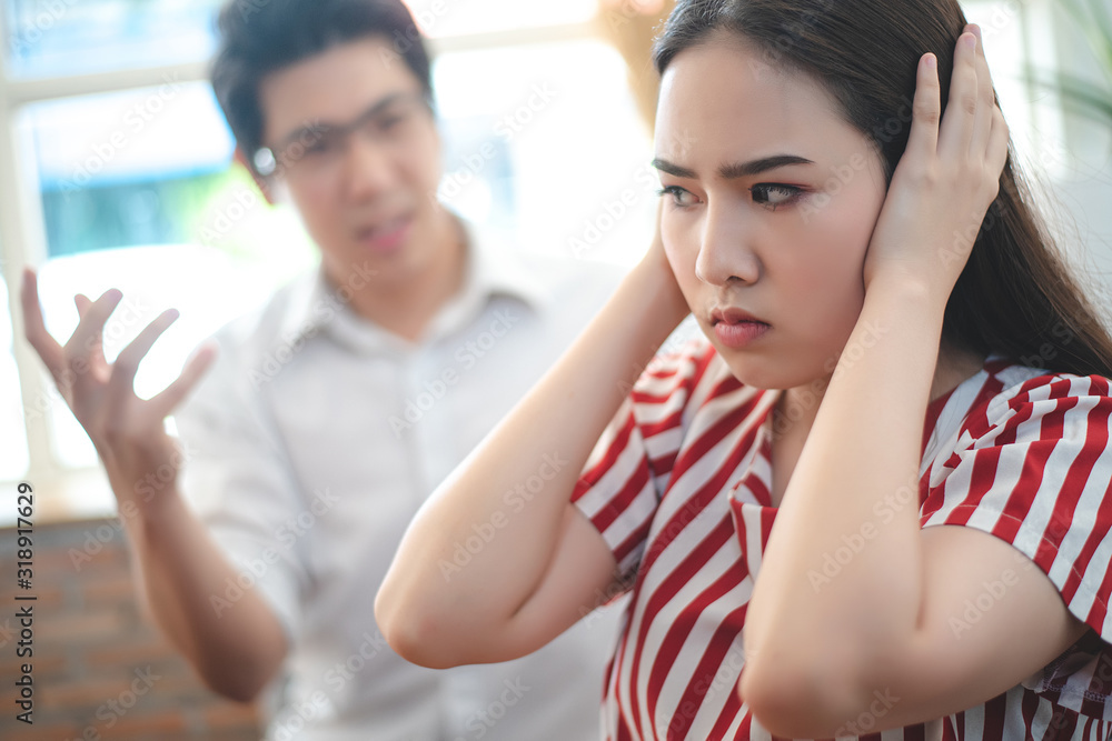 Couples are a serious quarrel. The women pose with both hands off the ...
