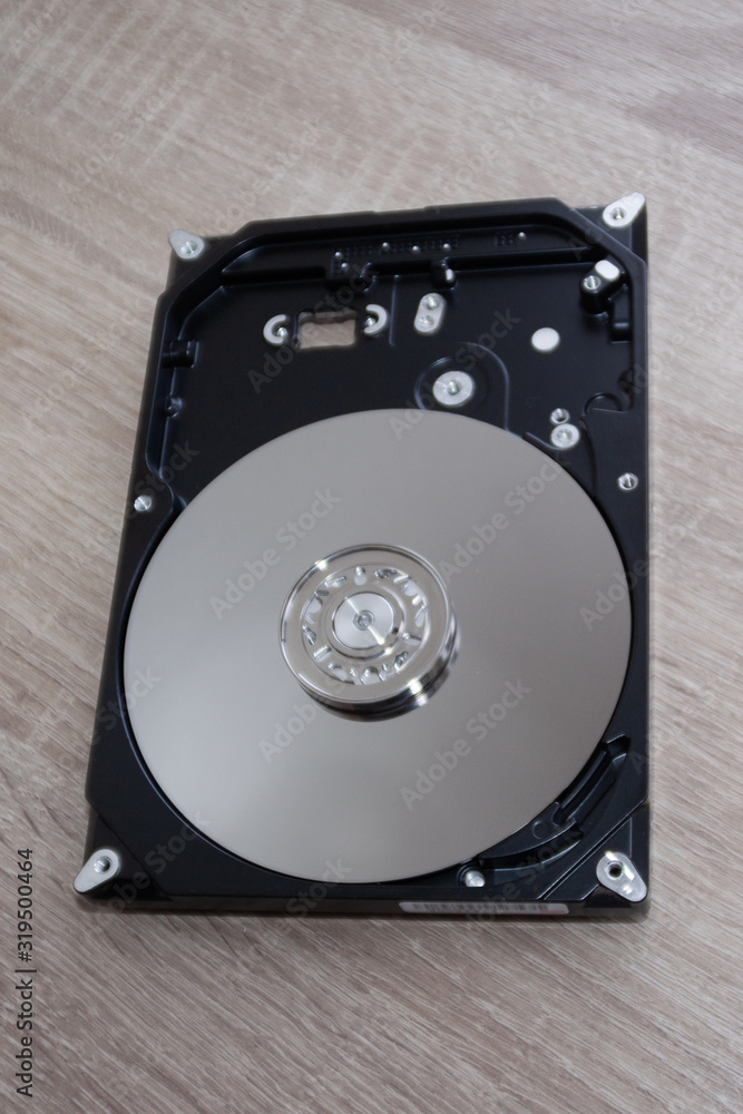 Disassembled computer hard drive device close-up. Dismantling ...