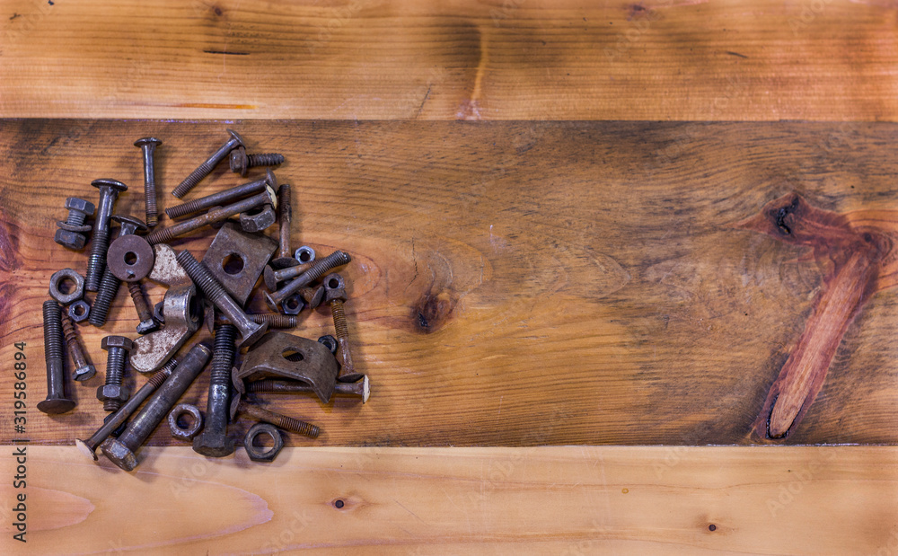 Working bench with rusty screws and bolts on the left side. Empty space ...