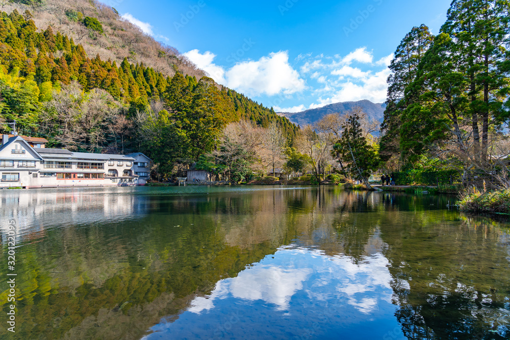 Golden Scale Lake and Yufu Mountain in winter sunny day with clear blue sky. This popular ...