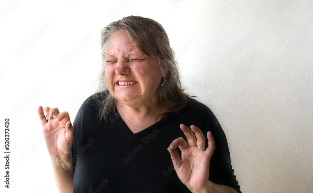 Old woman disgusted face expression. Elder modern woman closed her eyes ...