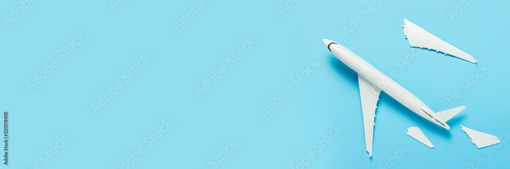 Broken plane on a blue background. The concept of a plane crash ...