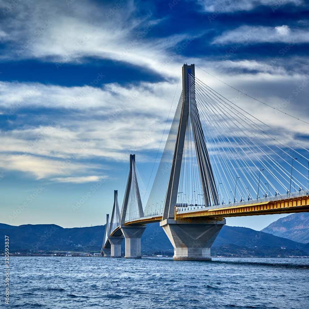 Foto de Stock Sunset view on the bridge near Patras. Suspension bridge ...