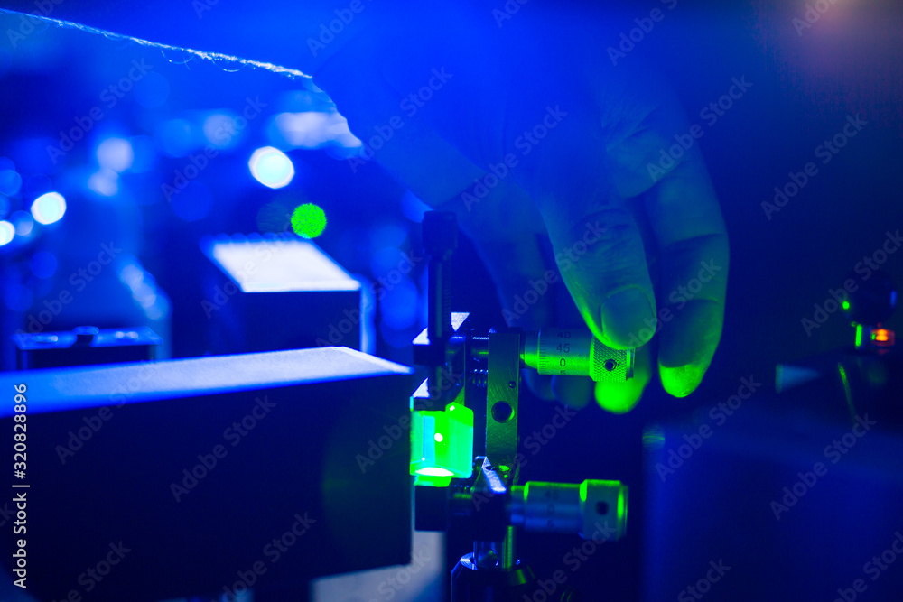 Lasers in a quantum optics lab - Researchers carrying out experiments ...