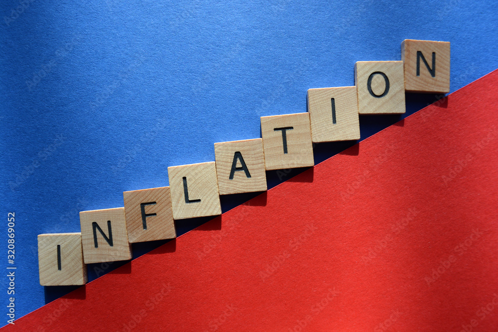 Inflation in 3d wooden alphabet letters on a blue and red background ...