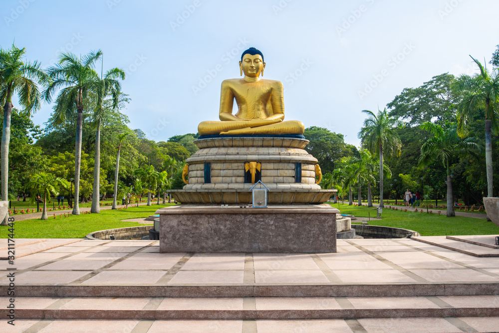 An iconic golden Buddha statue in Viharamahadevi Park a public park ...