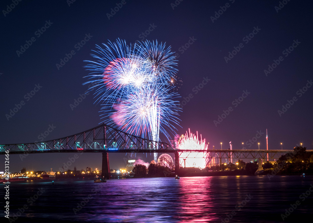 Photograph of fireworks. Jacques Cartier bridge with fireworks ...