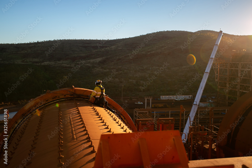 Safe work practices abseiler NDT technician wearing fall safety body ...