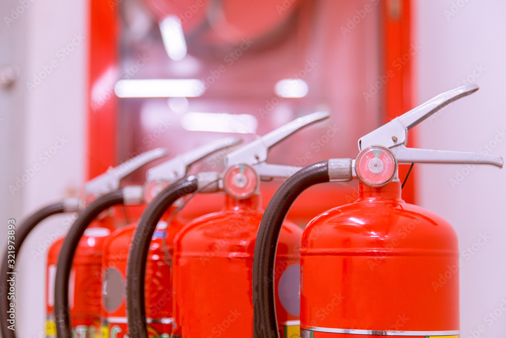 Red tank of fire extinguisher Overview of a powerful industrial fire ...