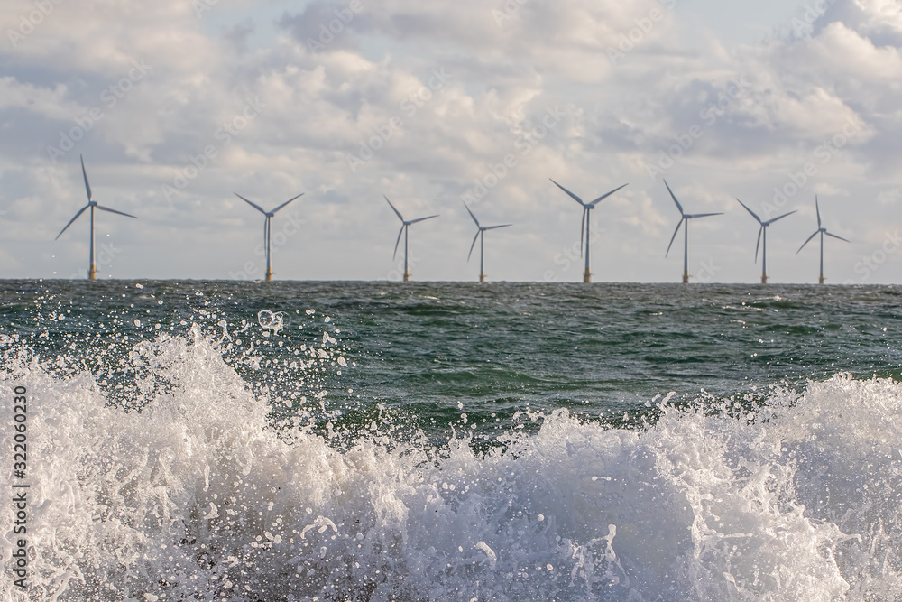 Wind and wave energy. Breaking waves with offshore windfarm turbines ...