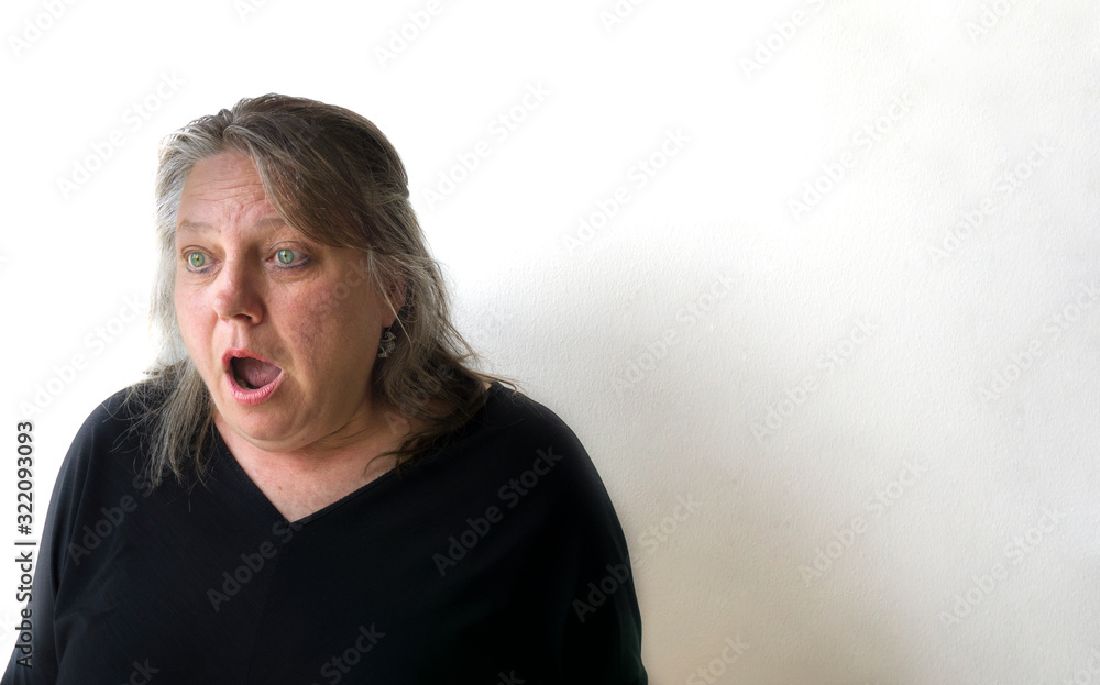 Surprised old woman face expression. Elder modern woman opened her ...