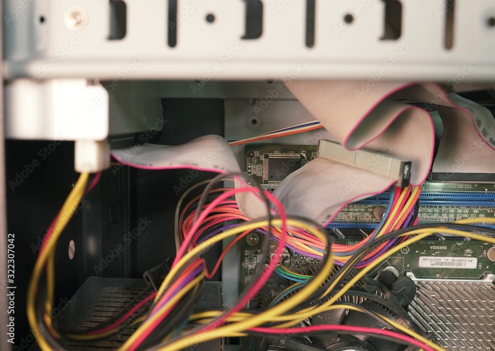 Computer power cables inside PC, macro. the bunch of wires inside of ...