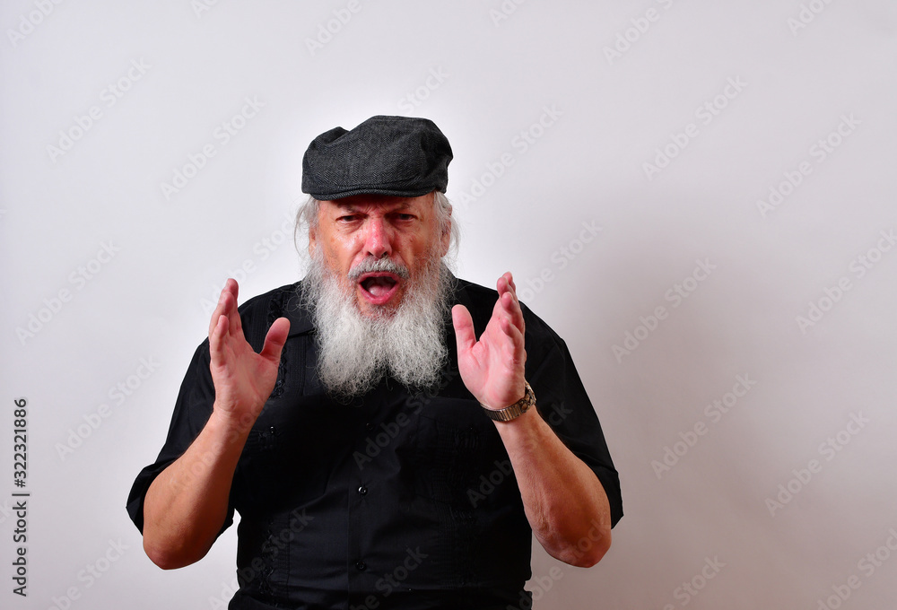 Man screaming in anger. .Mature gentleman with a newsboy cap and black ...