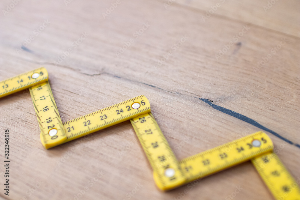 Folding zig zag ruler. Measuring tape folding yellow open in zigzag ...