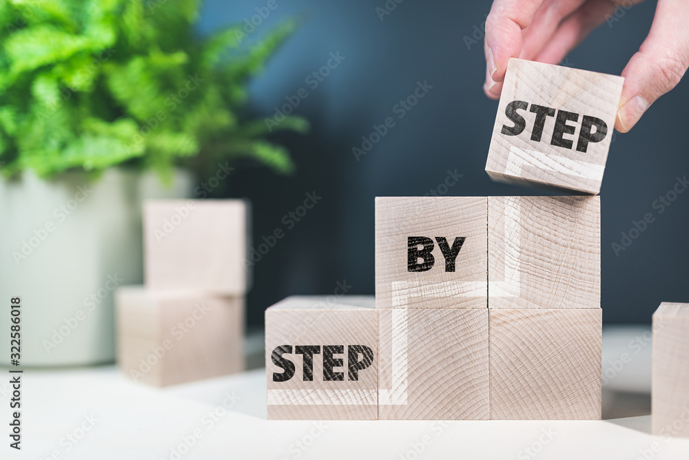 words step by step on wooden blocks, growth and progress concept Stock ...