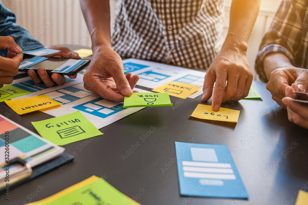 The web designer team is helping to design applications for mobile ...