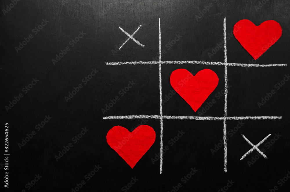 lovers day concept. tic-tac-toe game where instead of zeroes are red ...