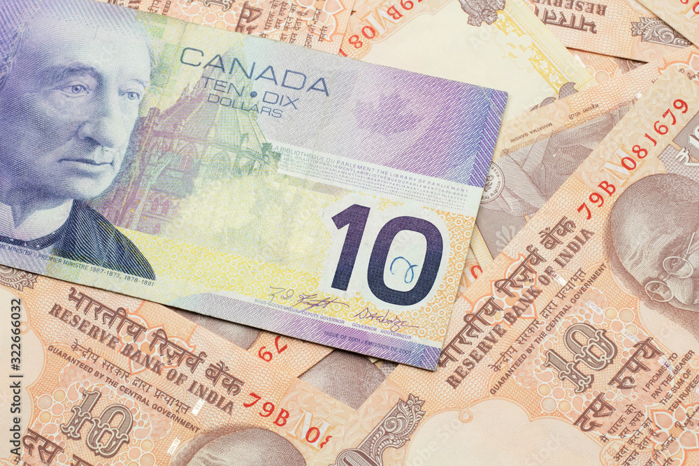 A macro image of a purple Canadian ten dollar bill on a background of ...