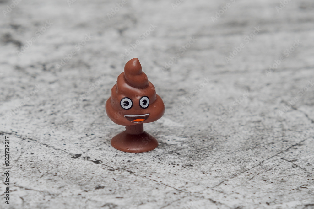 toy poop on a suction cup on a light abstract background Stock Photo ...