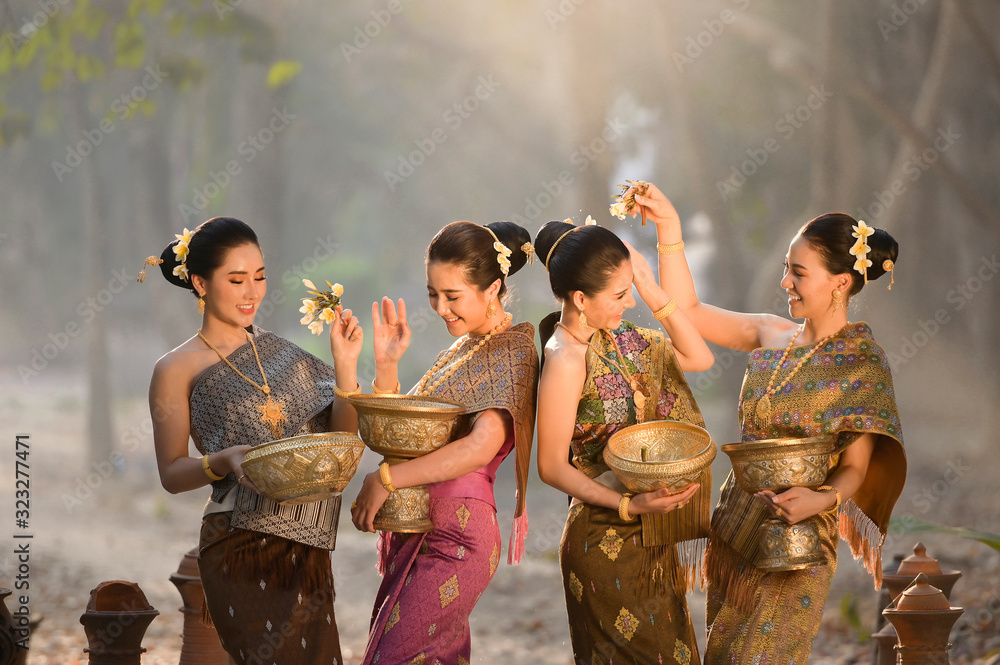 Thai girls and laos girls splashing water during festival Songkran ...