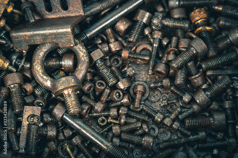 Pile of rustic nuts and bolts in grease. Stock Photo | Adobe Stock