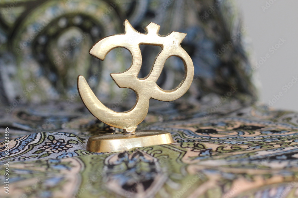 Figure of golden indian symbol aum. Stock Photo | Adobe Stock