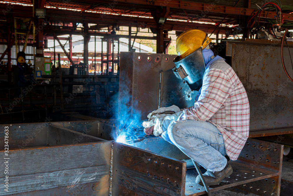 Photo Stock The welder is welding a steel structure work with process ...