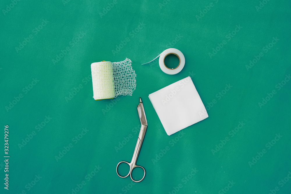 plaster ,net bandage ,gauze and scissors for dressing clean wound on ...