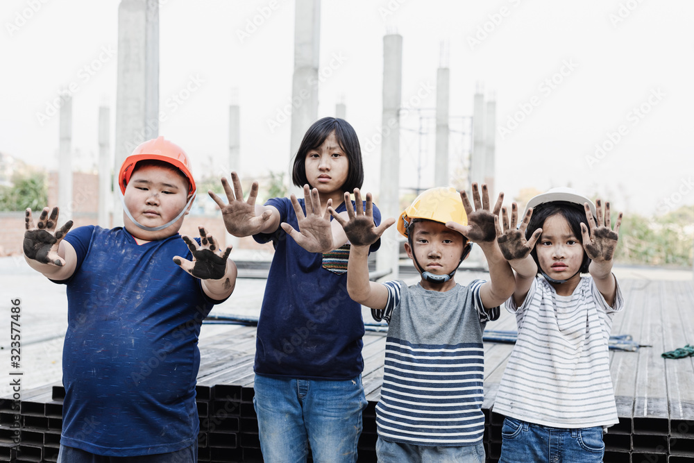World day against child labour concept. dirty hands of children from ...