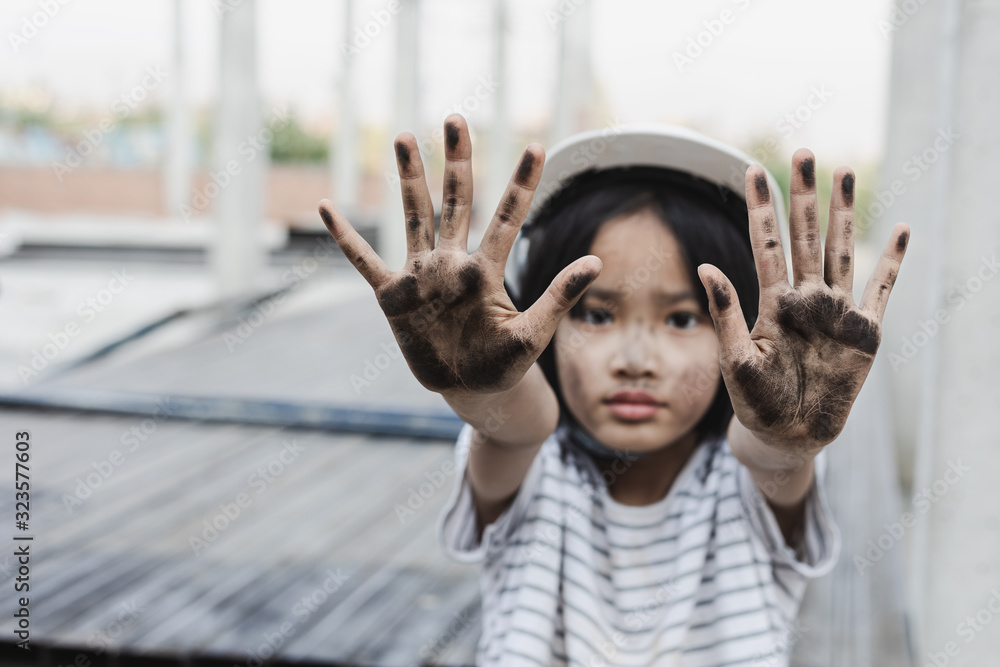 World day against child labour concept. dirty hands of children from ...