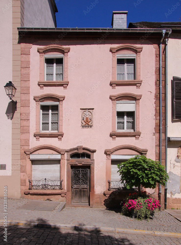 Historical facade of a baroque terraced house in a steep street in the ...