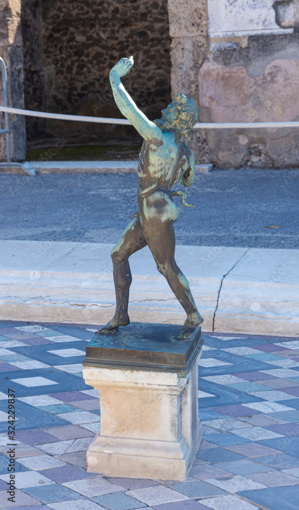Dancing Faun statue in House of the Faun in Pompeii. Italy tourism ...