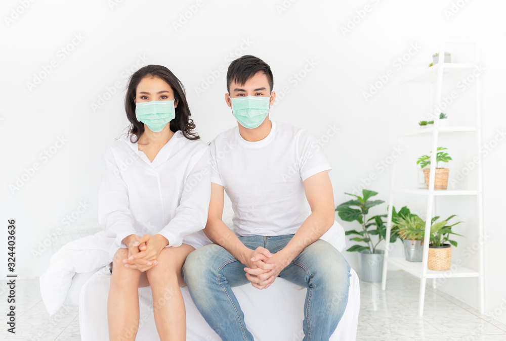 couple asian people wear surgical mask on white background, they ...