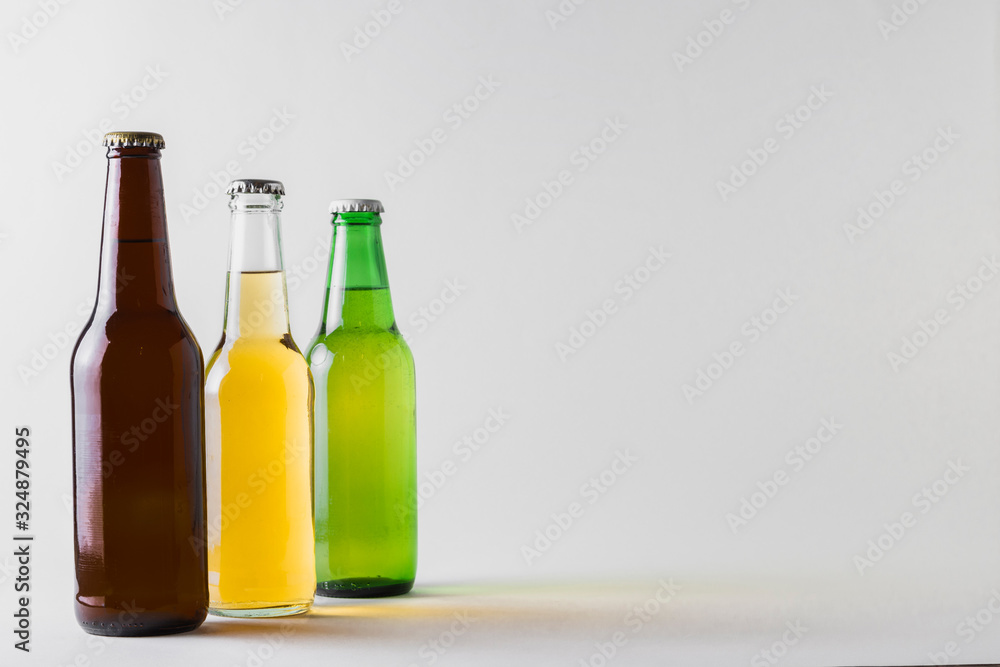Side view three different beers on table Stock Photo | Adobe Stock