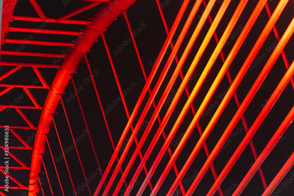 The illuminated structure of the Seri Saujana Bridge at night. One of ...